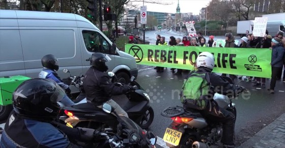 Climate change activists block road at Tower Bridge - Sharedots
