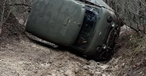 Utility Vehicle Gets Back Up After Being Stuck in a Rut - Sharedots