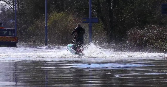 Man on jet-ski makes the most of flooding on submerged Yorkshire roads ...