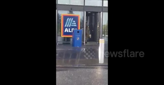 Funny moment man in leopard print gown walks out of Aldi with crate of ...