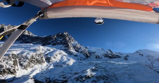 Ski-BASE Jumping off an Ice Cliff - Sharedots