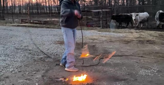 Guy Spins a Large Flaming Lasso - Sharedots
