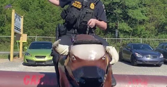 Ex-Police Officer Rides Mechanical Bull - Sharedots