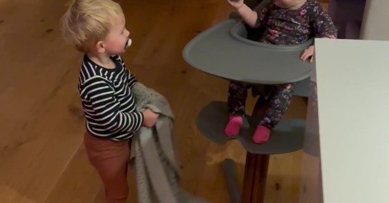 Baby Laughs at Older Brother Playing Peek-a-Boo - Sharedots